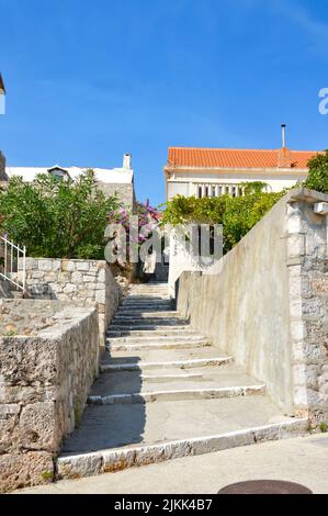 A small street in Bol, a village on an island in the Adriatic Sea ...