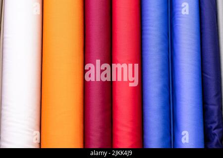 The colorful bolts of fabric for making shirts by a tailor Stock Photo ...