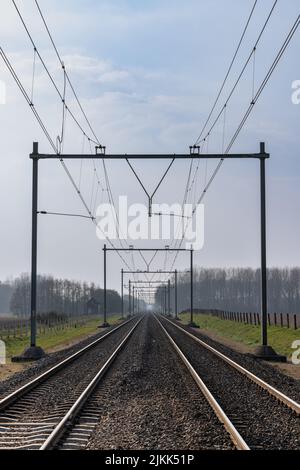 Vertical shot of railroad tracks in a station Stock Photo - Alamy
