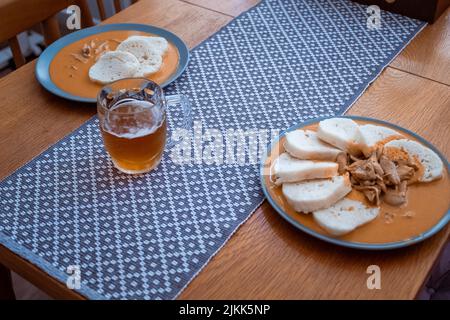 Traditional chicken hen on paprika or paprica creamy sauce with bread ...