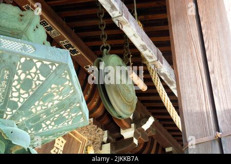 Low angle shot of ceiling with artefacts in front of temple - shrine in ...