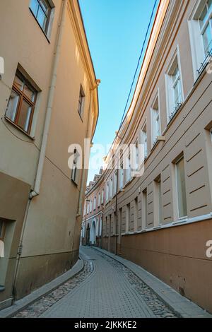 Vertical shot of residential buildings surrounded by lights in the ...