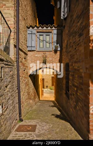 A vertical shot of a narrow alley between the brick buildings Stock ...
