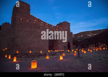 Luminarias light the pathways of the Jemez Mission State Monument at ...