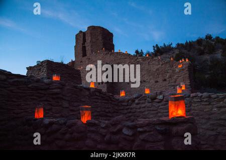 Luminarias light the pathways of the Jemez Mission State Monument at ...
