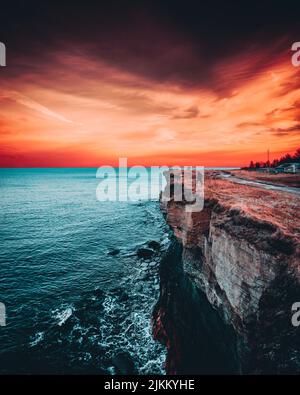 A vertical shot of a man standing near graffiti walls Stock Photo - Alamy