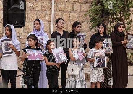Lalish, Iraq. 02nd Aug, 2022. Yazidis react emotionally in front of a ...