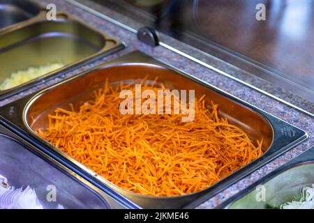 Spicy Korean carrot salad, morkovcha, served in rustic black bowl ...