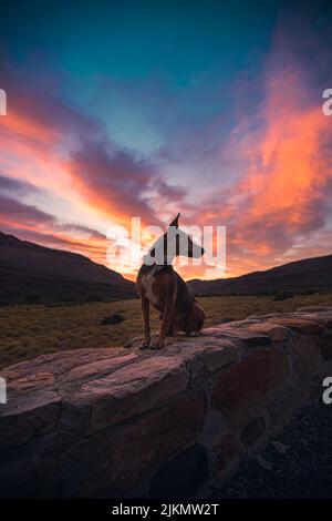 A mesmerizing shot of a stone wall in a landscape under the cloudy sky ...