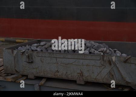Loading cast iron ingots on ship bulk. Loading metal on ship ...