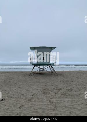 Vertical shot of a lifeguard tower on a beach at sunset Stock Photo - Alamy