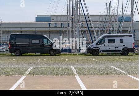 White mini bus side view isolated on white Stock Photo - Alamy