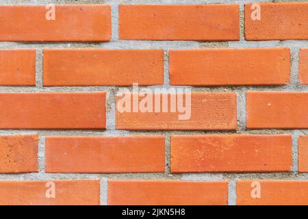 A closeup shot of a red brick wall texture for an abstract vintage ...