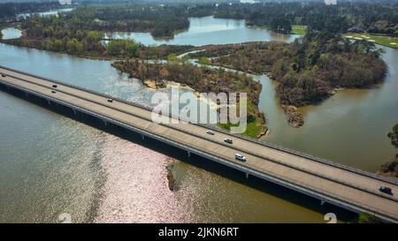 An aerial shot of a bridge surrounded by forest Stock Photo - Alamy