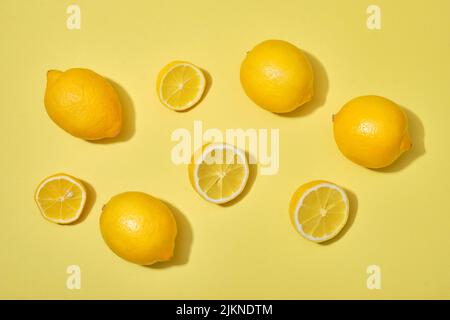 Lemon top view with halves and whole ripe lemons on white background ...