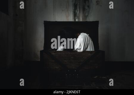 Asian ghost horror creepy scary hair covering face and eye lying in the ...