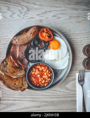 Top view of fried eggs with sausage, bread and vegetable Stock Photo ...