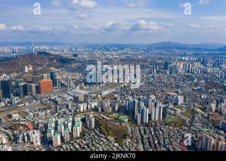 An aerial cityscape of Seoul surrounded by buildings in background of ...
