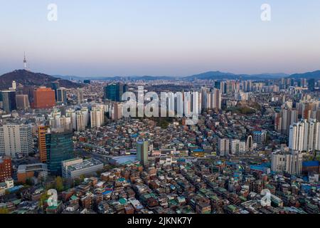 An aerial cityscape of Seoul surrounded by buildings in background of ...
