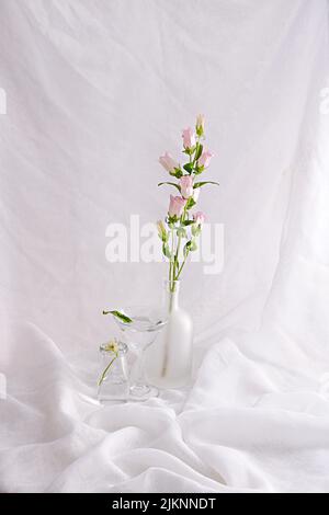 A vertical shot of a bouquet of eustomas in the vase Stock Photo - Alamy