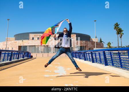 Mature gay man, executive, grey hair, beard, sunglasses, jacket and tie ...