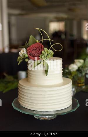 A vertical shot of a 3 tier beautiful floral cake Stock Photo - Alamy