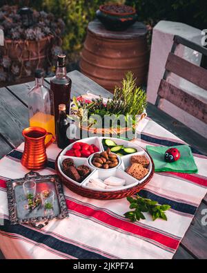 A vertical shot of a wooden table placed next to a window in a cozy ...