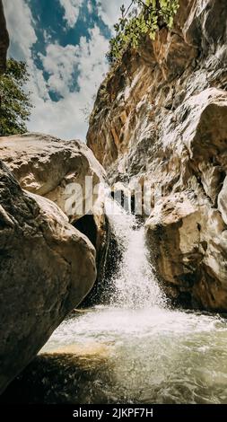 A beautiful shot of a streaming rocky river in the woods Stock Photo ...