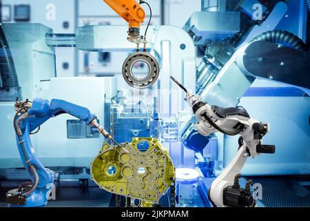 Industrial automation robotic teamwork working with circuit board on ...