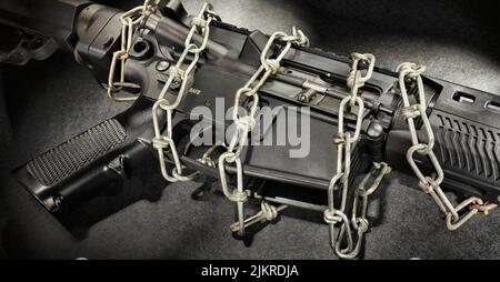 AR-15 with chain wrapped around to keep it safe Stock Photo - Alamy