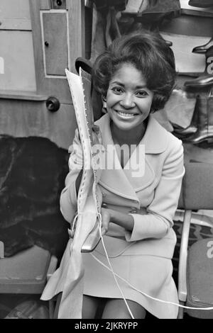 NANCY WILSON (1937-2018) American singer shopping for boots on Oxford ...