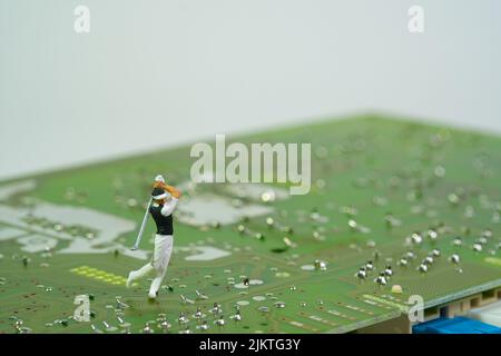 a golfer teeing off on an electronic circuit board, typical golfer ...