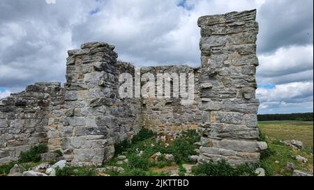 A beautiful shot of a Rothley Castle with a green grass field and a ...