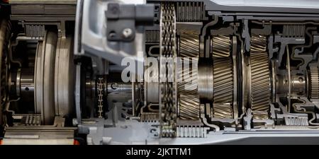 Car engine and gearbox cross section cut in half to display engineering ...