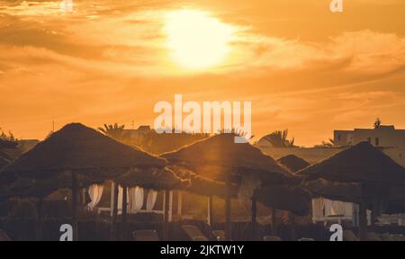 A mesmerizing sunset over the beautiful coast Stock Photo - Alamy