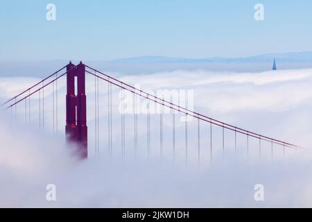 An incredible fog over Golden Gate Bridge in San Francisco, California ...