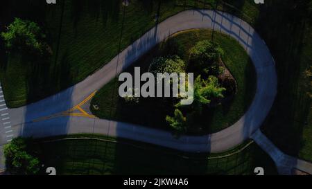 An aerial view of roundabout surrounded by greenery fields Stock Photo ...