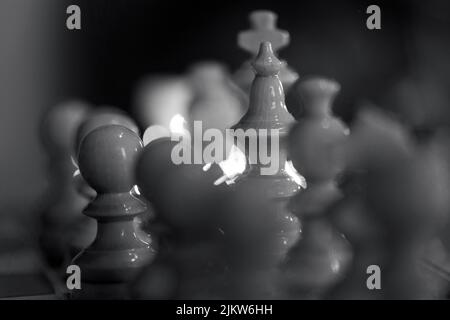 A grayscale closeup of the white chess pieces. Selected focus Stock ...