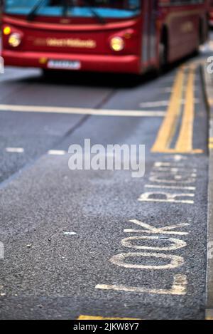 a vertical shot of red double decker buss on bus stop Stock Photo - Alamy