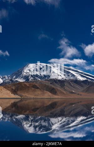 A mesmerizing view of beautiful snow-capped mountains Stock Photo - Alamy