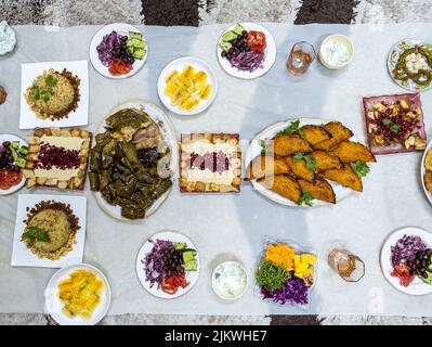 A closeup of the traditional Kurdish dinner table with different dishes ...