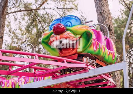 A strange and frightening attraction in an outdoor circus and amusement ...