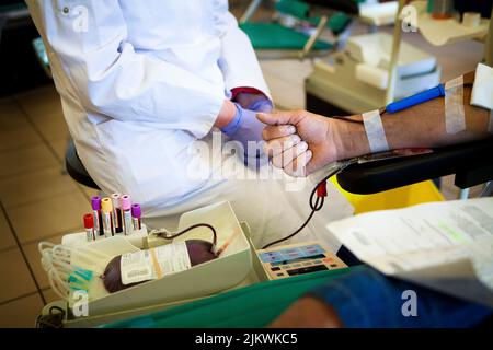 Donate blood at a blood collection facility Stock Photo - Alamy