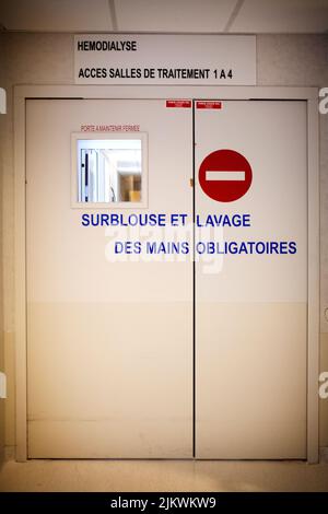 Signs in hospital hallway Stock Photo - Alamy