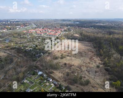 A drone shot of a cityscape under cloudy sky at sunset Stock Photo - Alamy
