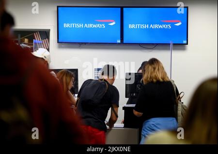 Airline passengers checking in area, Heathrow Airport, 1980s Stock ...