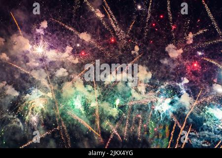 Beautiful multi-colored fireworks against the background of the night ...