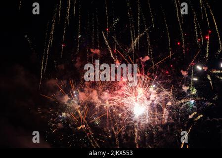 Beautiful multi-colored fireworks against the background of the night ...