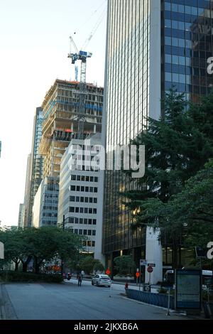 The downtown Vancouver with busy streets and modern cars, tall ...