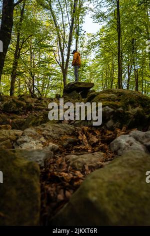 A man at the Aitzetako Txabala Dolmen in the Basque Country. Errenteria ...